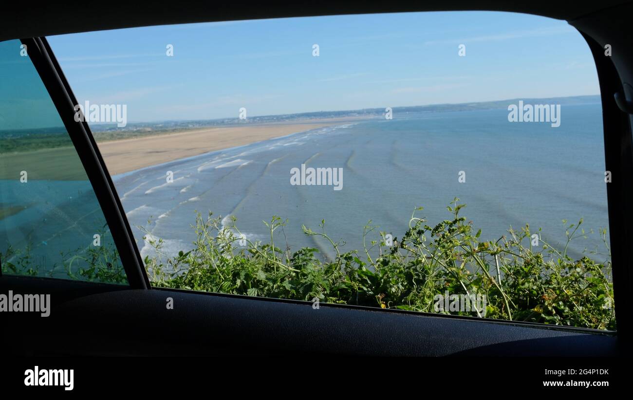 Blue sea and empty beach from a car window Stock Photo - Alamy