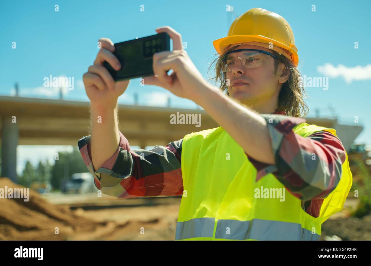 Building contractor with mobile phone shooting work they done Stock ...