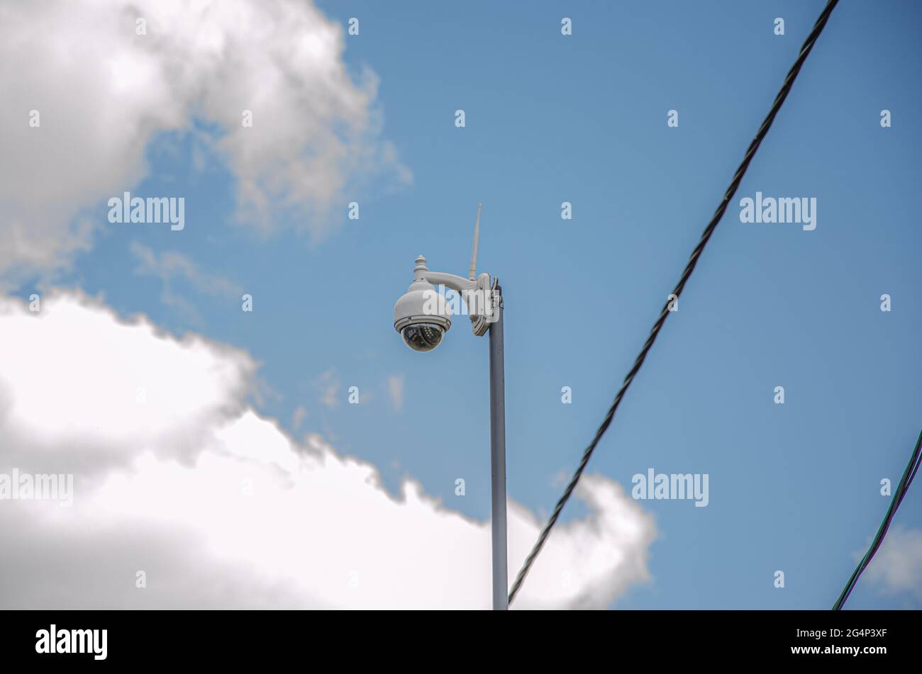 surveillance security camera video equipment on pole outdoor building ...