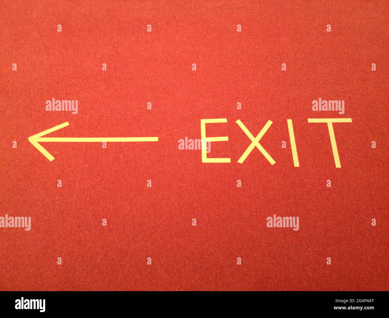 "Exit" sign with an arrow to the left on a red background Stock Photo ...