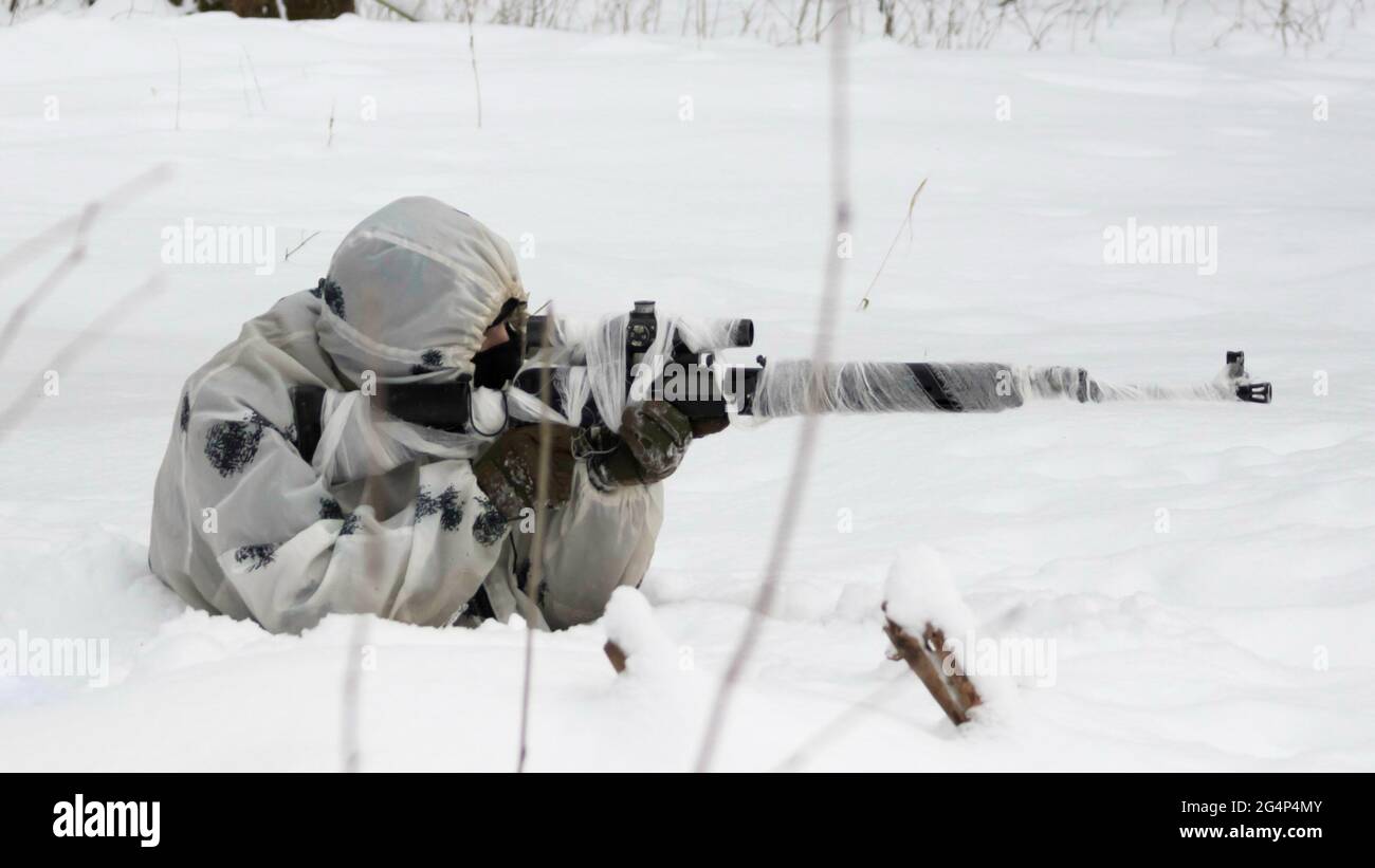 Moscow, Russia. 7th Feb, 2018. A sniper in a position looks through the ...