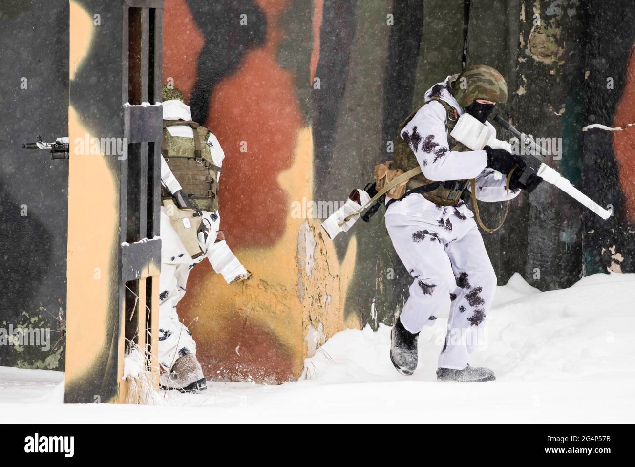 Snipers enter buildings covering each other during a sniper training ...