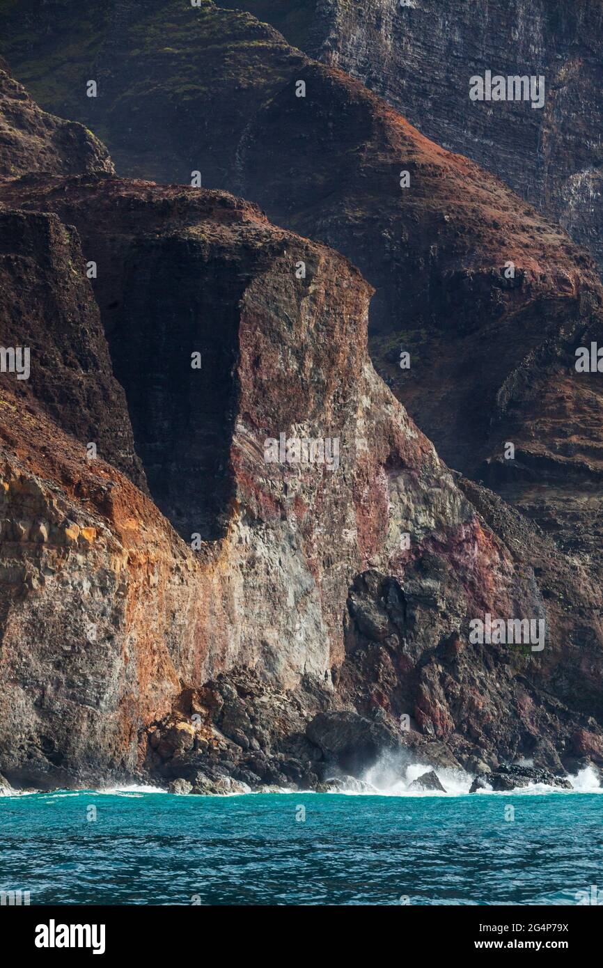 Dramatic lava formations drop into the Pacific ocean along the NA PALI ...