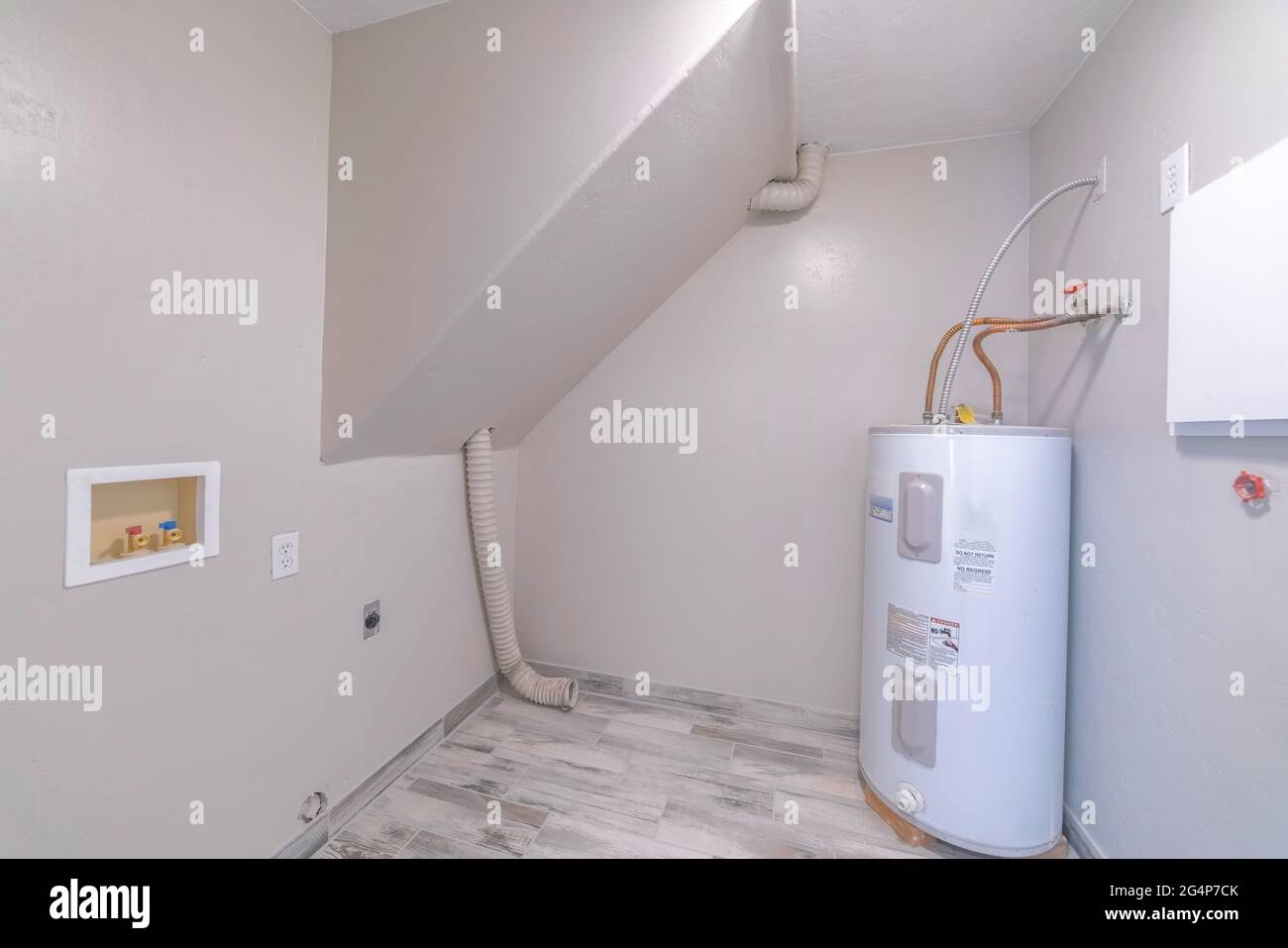 An electric water heater in a room Stock Photo - Alamy