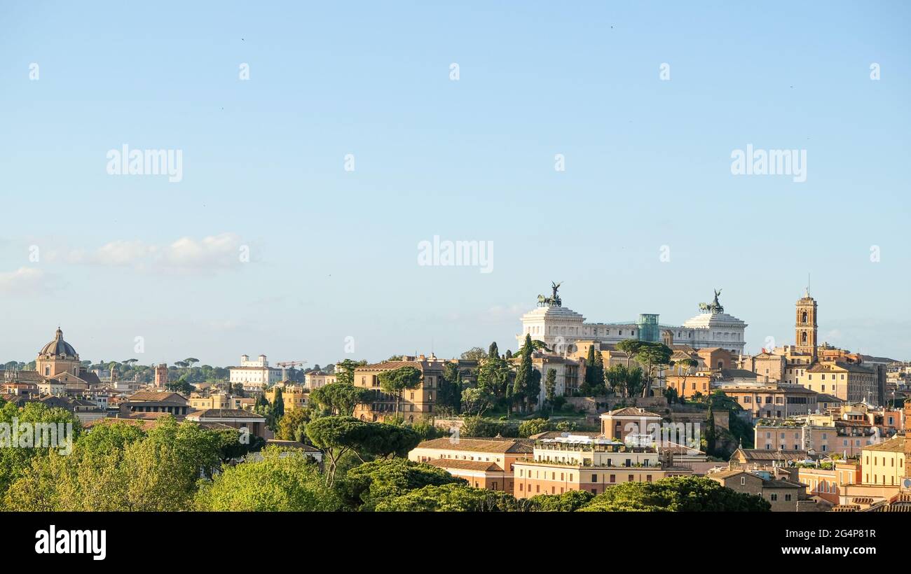 Sunset over Rome. From left: dome of Jesus Church, the Altar of the ...