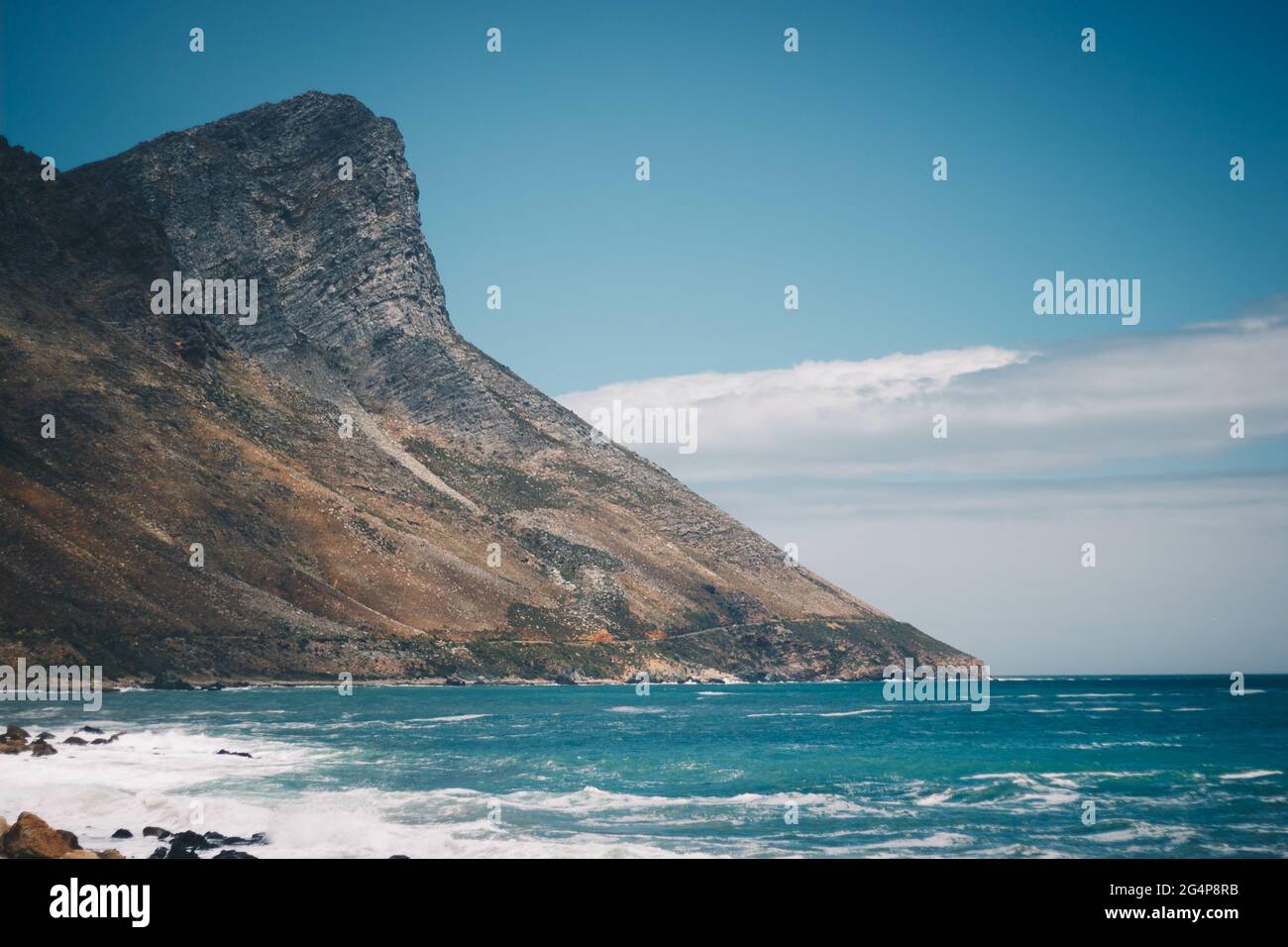 Beautiful shot of the Cape Peninsula shore in South Africa with Cape Point in the background ...