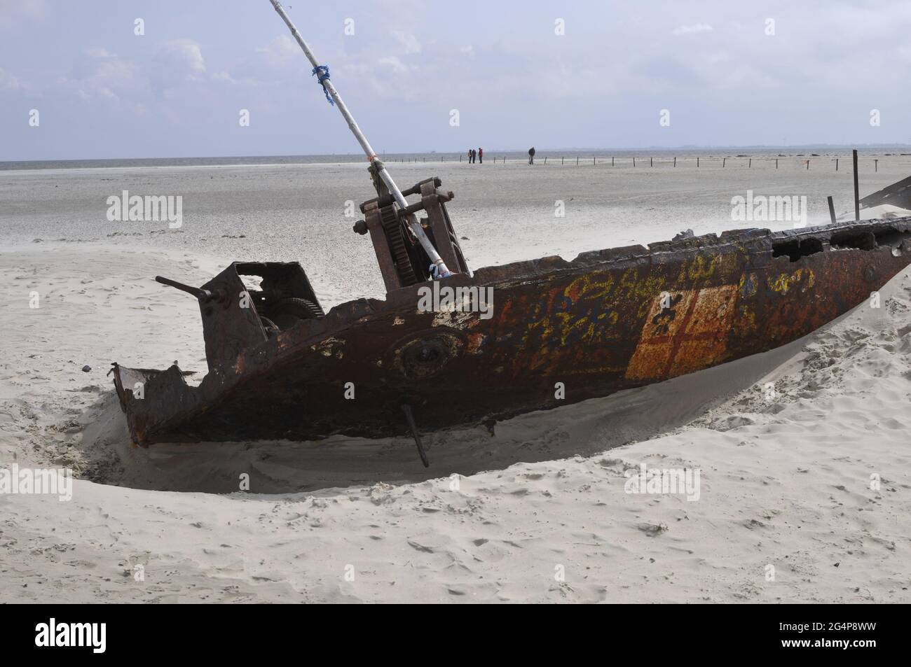 Old rusty abandoned boat stuck on a sandy beach Stock Photo - Alamy
