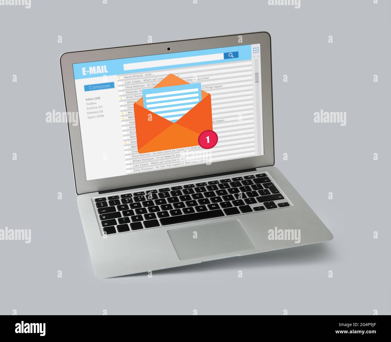 Received email message on screen of laptop against grey background ...