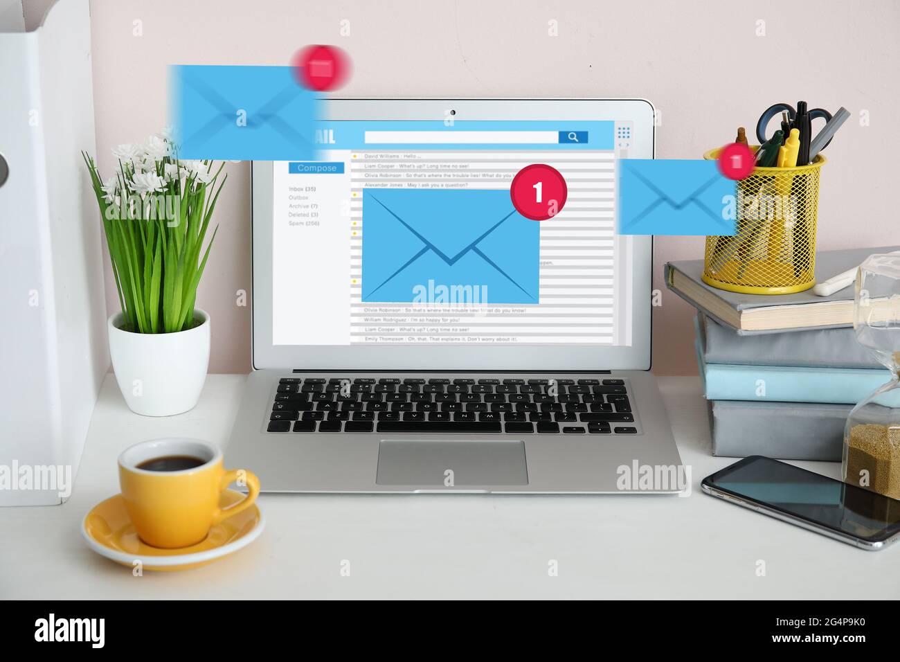 Received email message on screen of laptop at workplace Stock Photo - Alamy