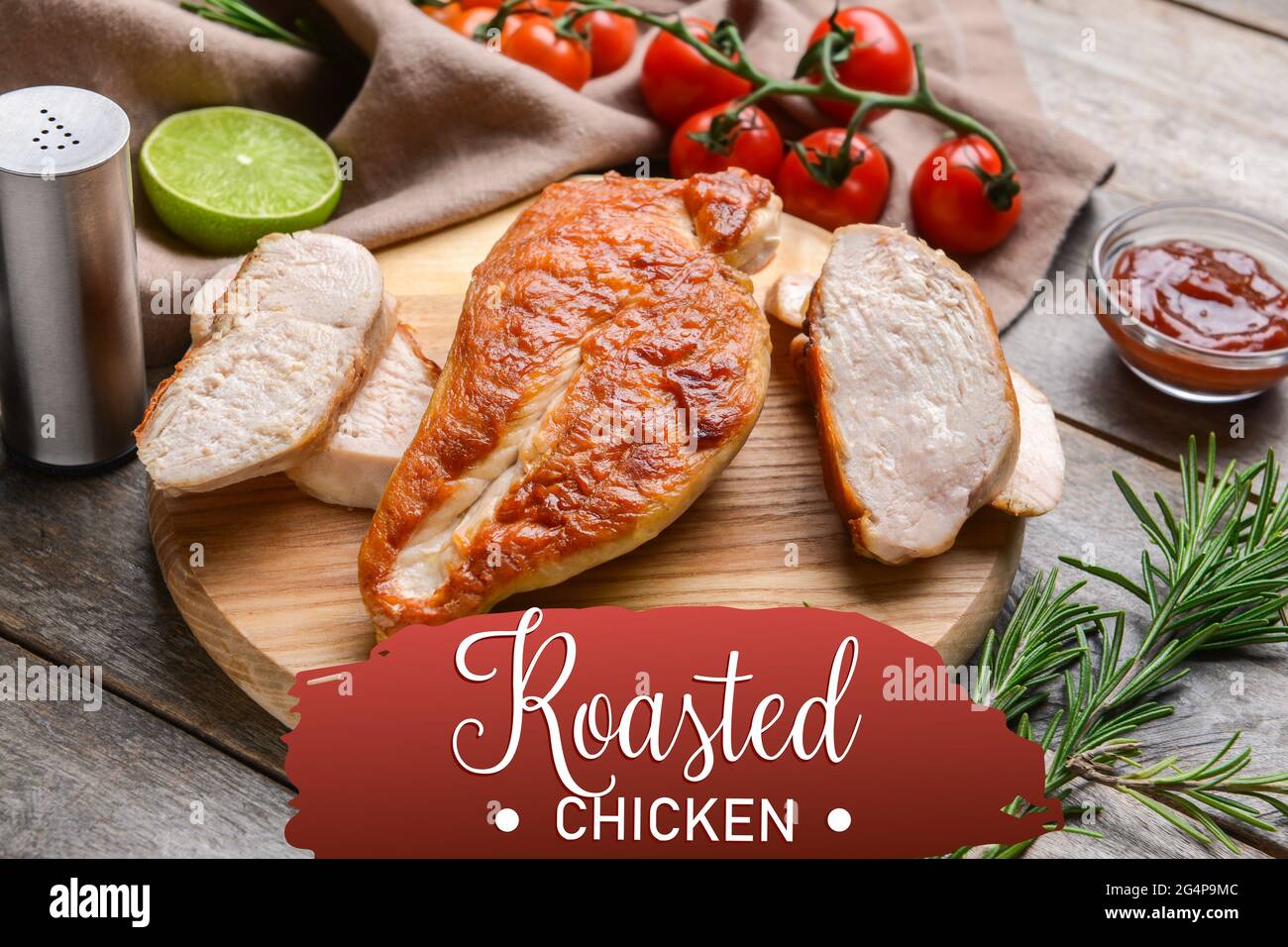 Tasty roasted chicken fillet on wooden table Stock Photo - Alamy