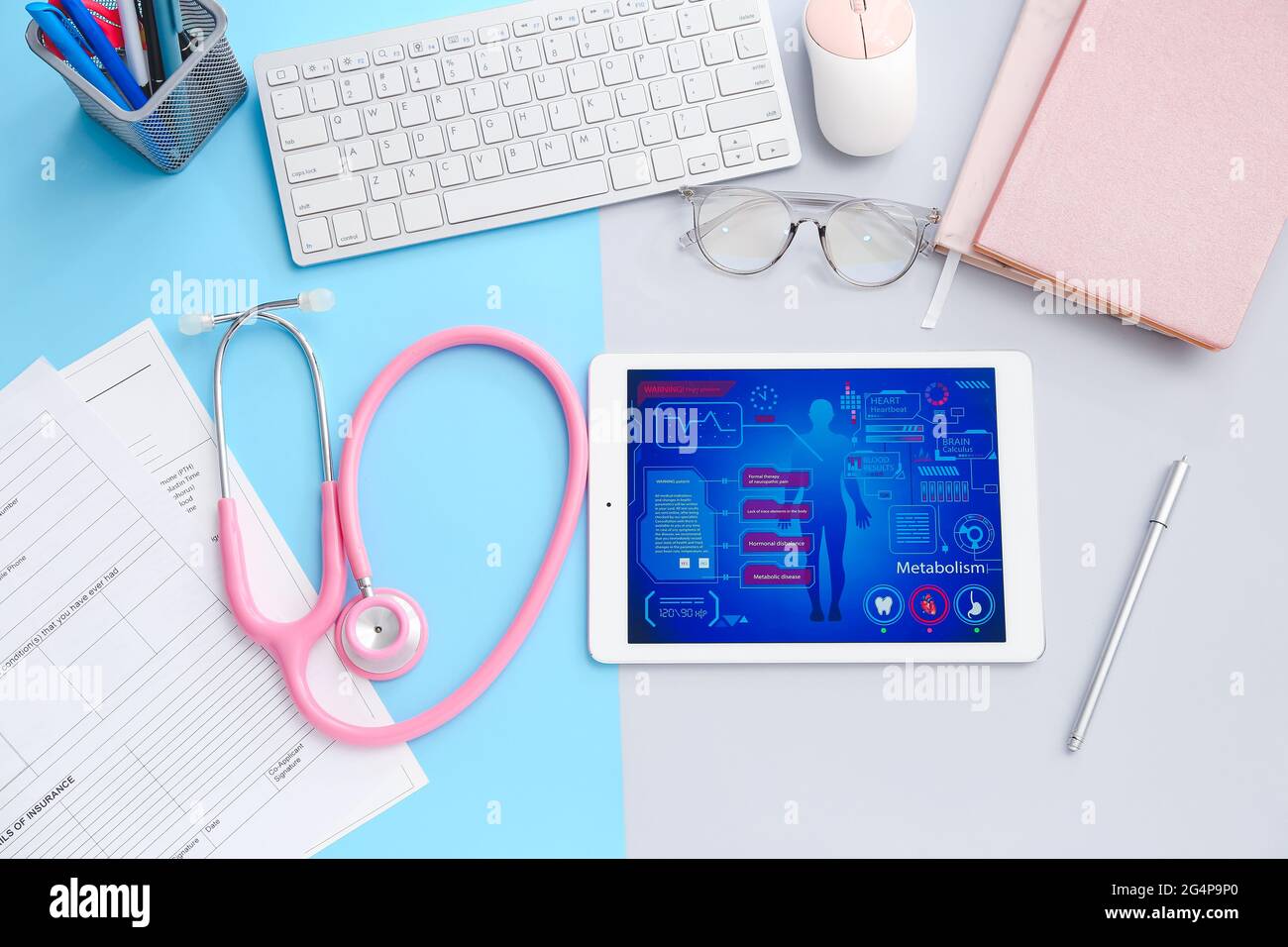 Tablet computer with stethoscope, insurance form and accessories of ...
