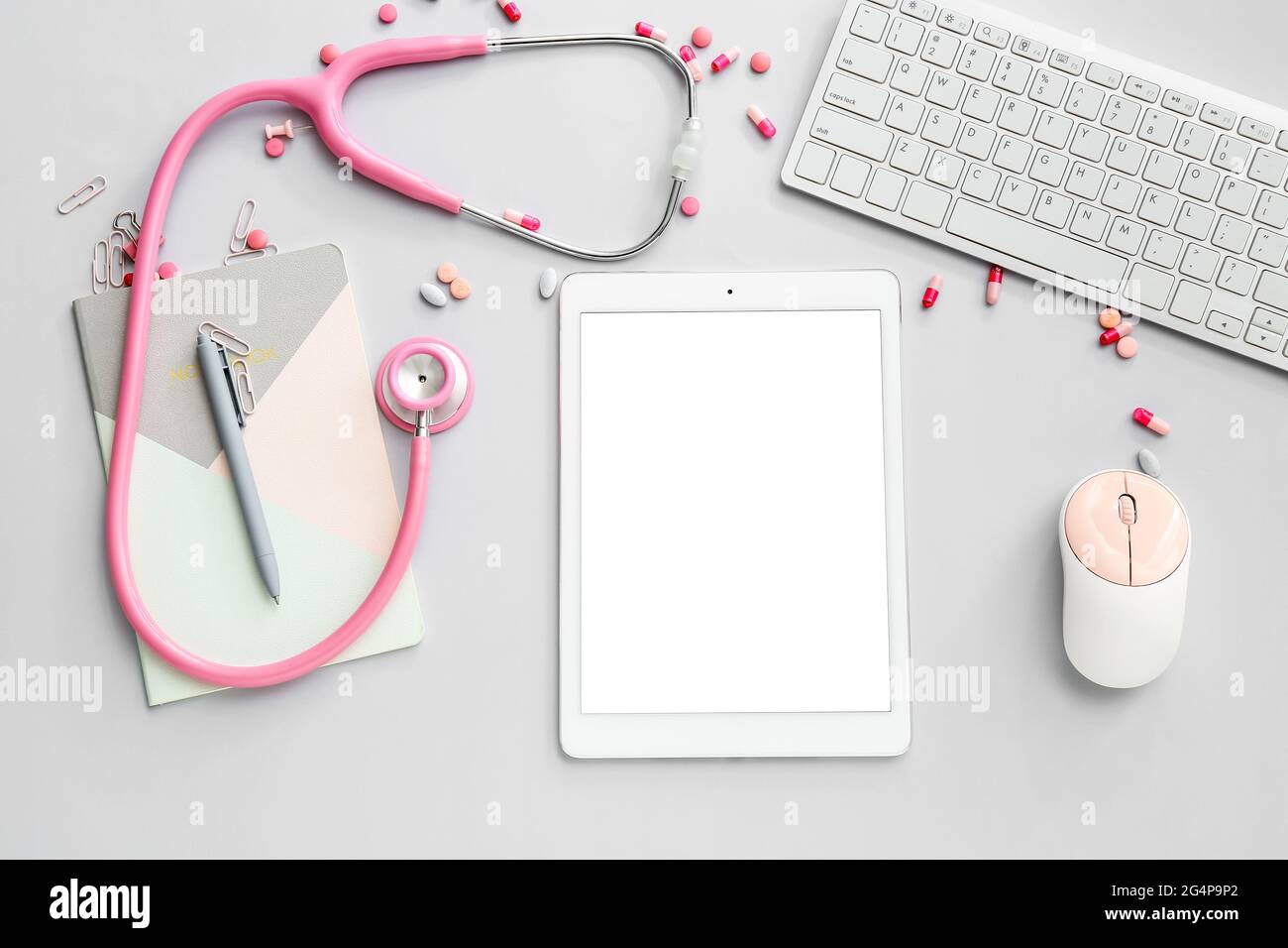 Tablet computer with stethoscope, pills and accessories of doctor on ...
