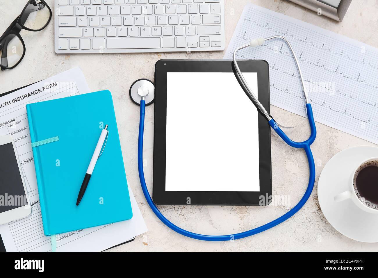 Tablet computer with stethoscope and accessories of doctor on grunge ...