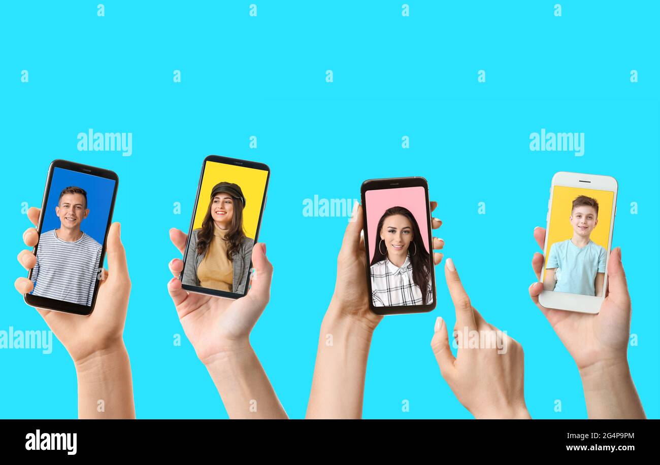Group of people with mobile phones taking photo on color background ...