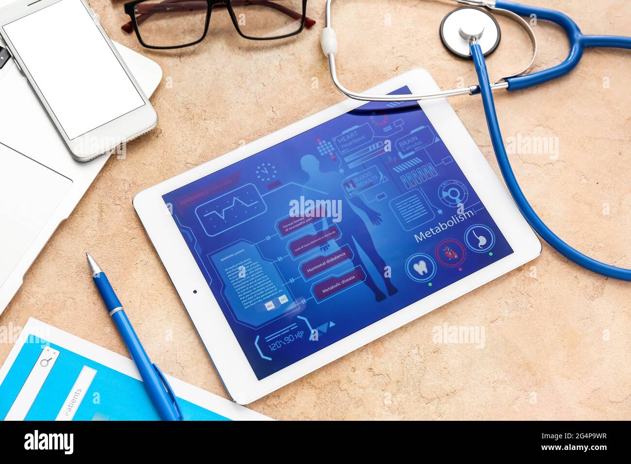 Tablet computer with accessories of doctor on color background Stock ...