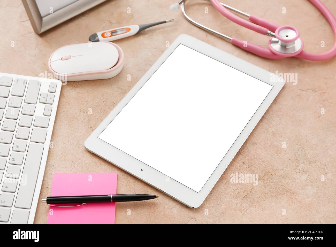Tablet computer with accessories of doctor on color background Stock ...