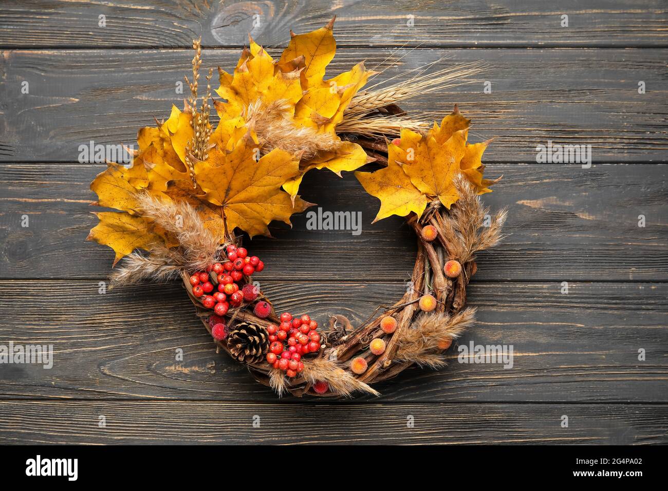 Beautiful autumn wreath on wooden background Stock Photo - Alamy