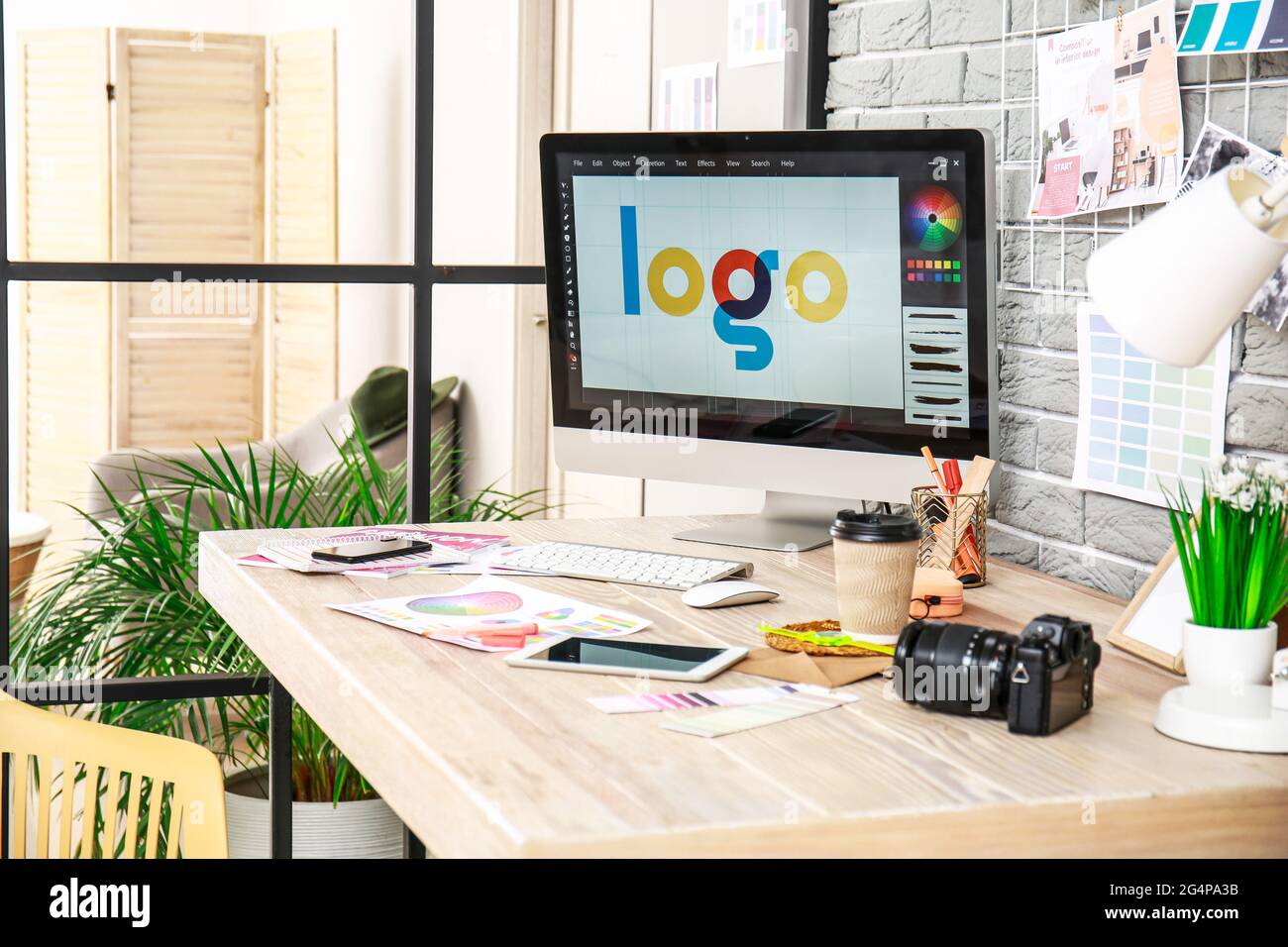 Comfortable workplace of graphic designer in office Stock Photo - Alamy
