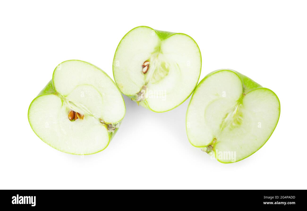 Halves of fresh green apples on white background Stock Photo - Alamy