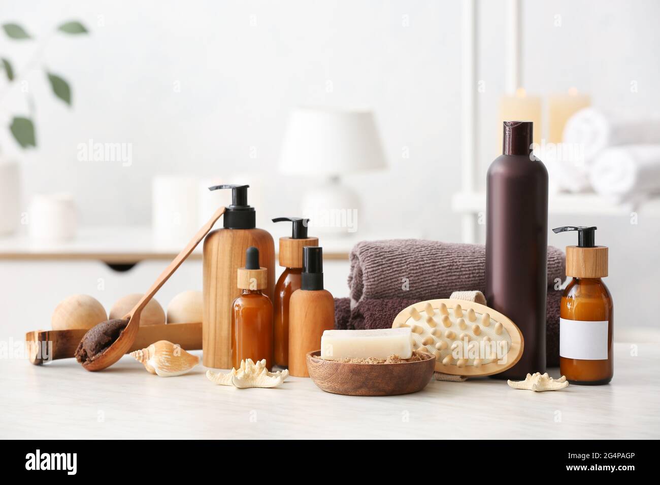 Spa set with bottles of cosmetics on light background Stock Photo - Alamy