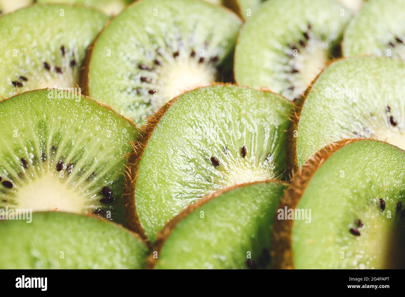 Many cut kiwi as background Stock Photo - Alamy