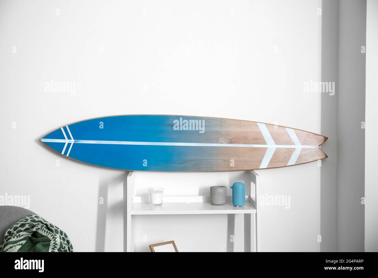 Interior of modern stylish room with surfboard hanging on wall Stock ...