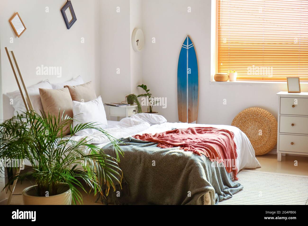 Interior of modern bedroom with surfboard Stock Photo - Alamy