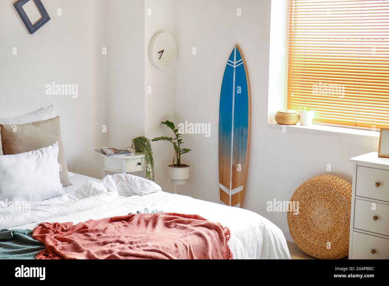 Interior of modern bedroom with surfboard Stock Photo - Alamy