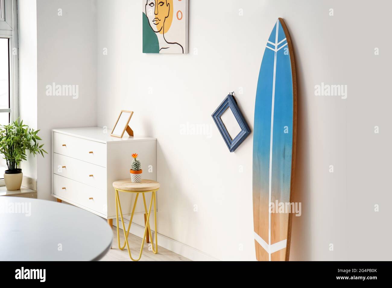 Interior of modern room with surfboard Stock Photo - Alamy