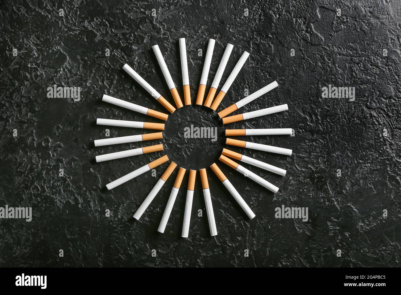 Frame made of cigarettes on dark background Stock Photo - Alamy
