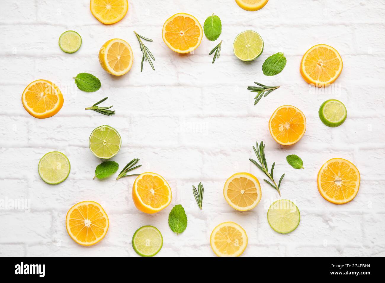 Frame made of healthy citrus fruits on brick background Stock Photo - Alamy