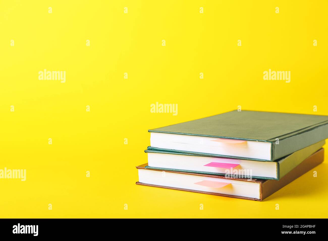 Books with bookmarks on color background Stock Photo - Alamy