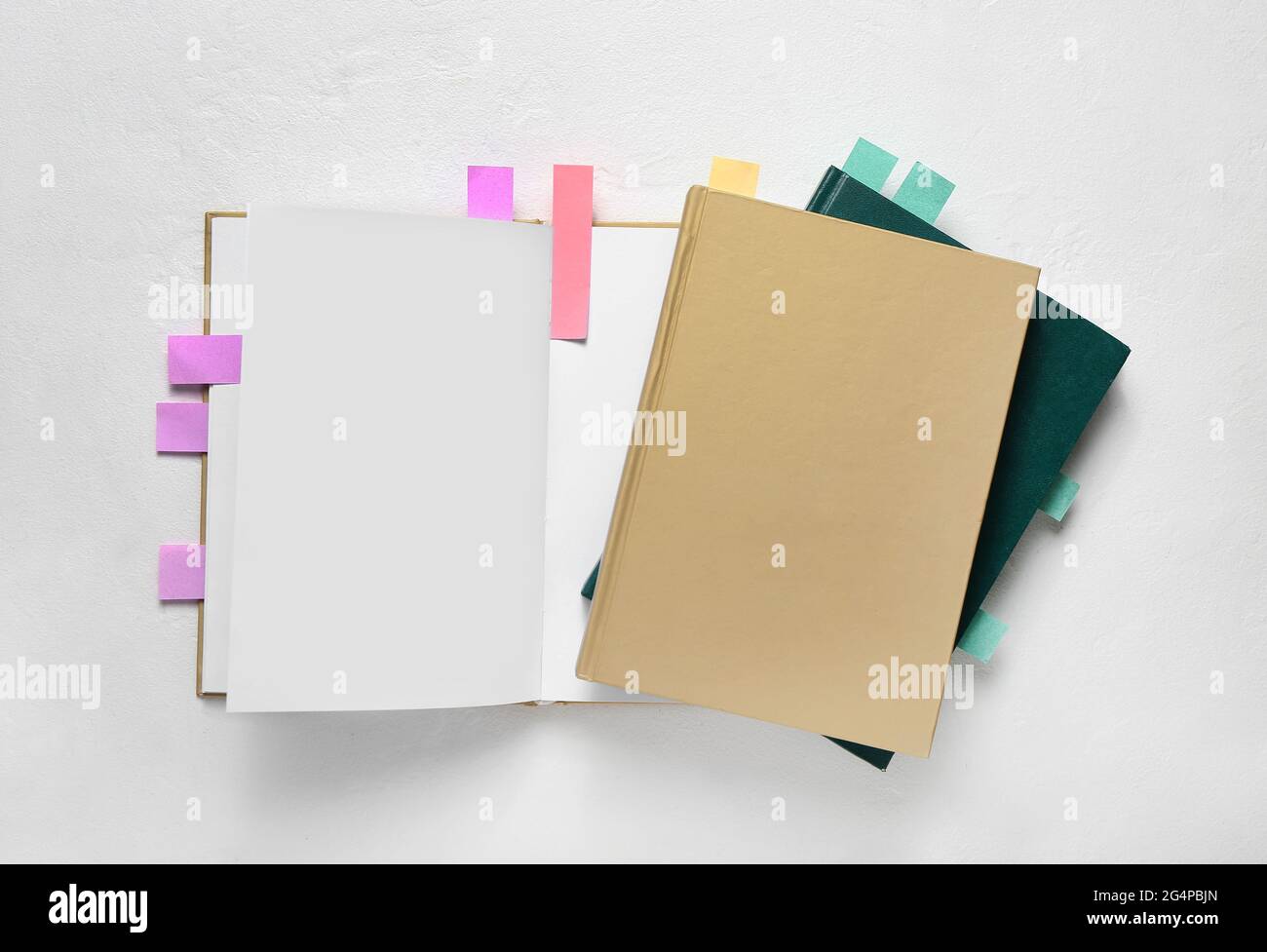 Books with bookmarks on white background Stock Photo - Alamy