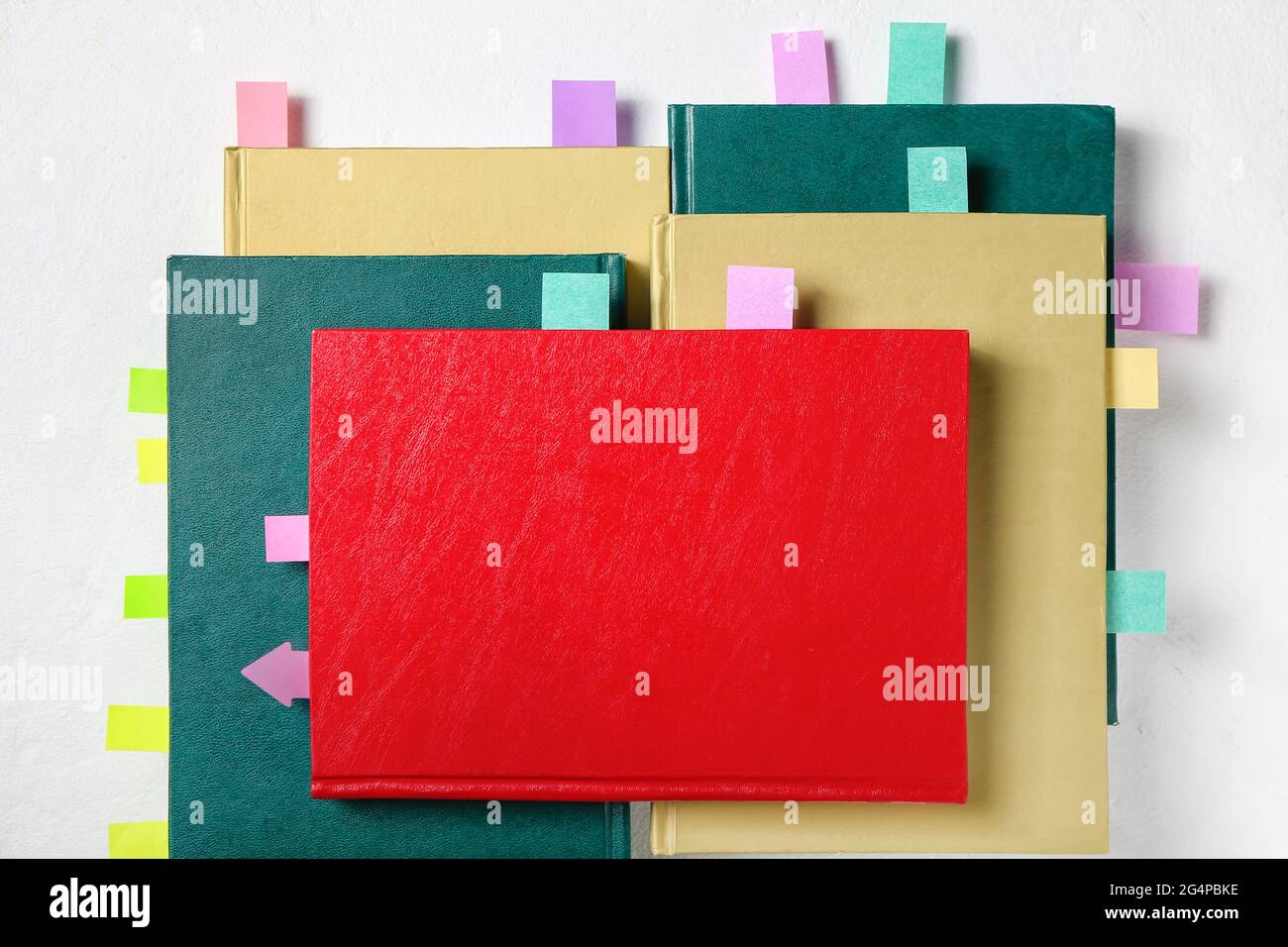 Books with bookmarks on white background Stock Photo - Alamy