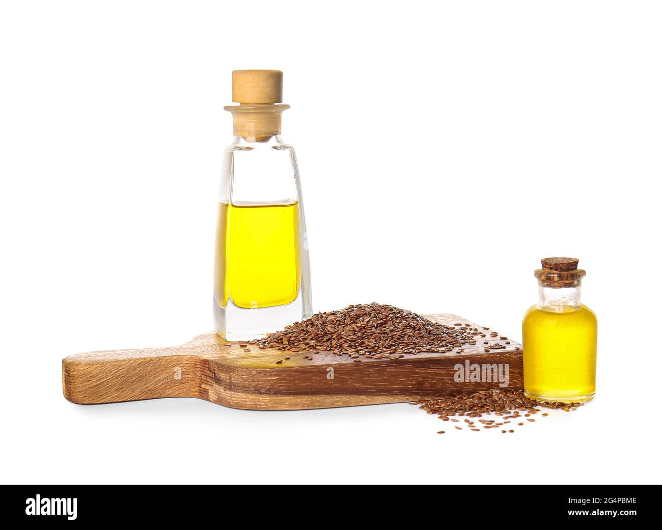 Bottles of flax oil and seeds on white background Stock Photo - Alamy