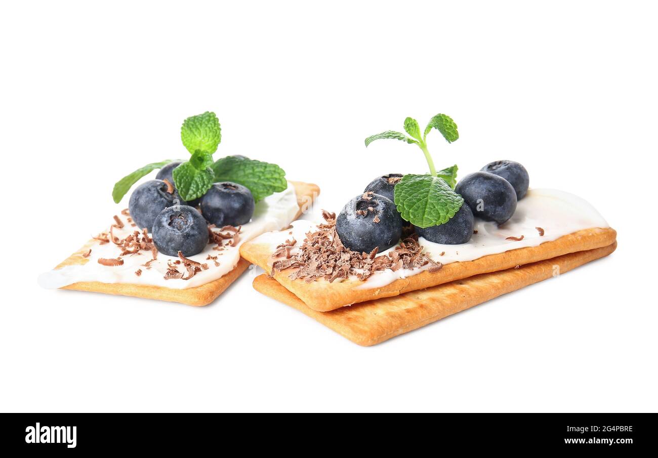 Tasty crackers with blueberry on white background Stock Photo - Alamy