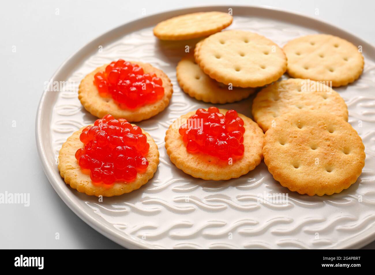Tasty crackers with red caviar on grey background, closeup Stock Photo ...
