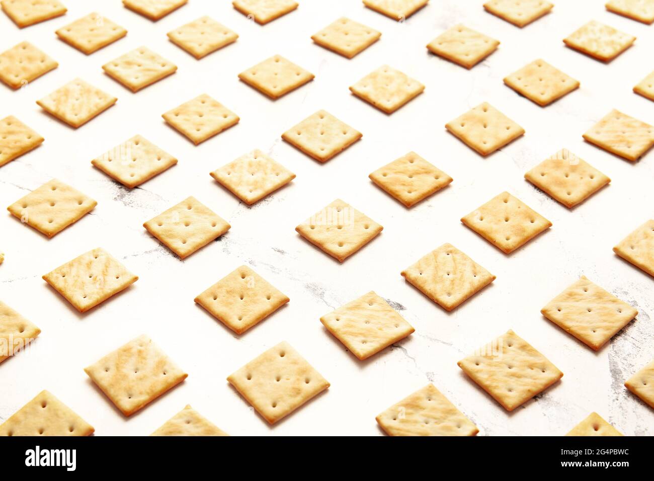 Tasty crackers on light background Stock Photo - Alamy