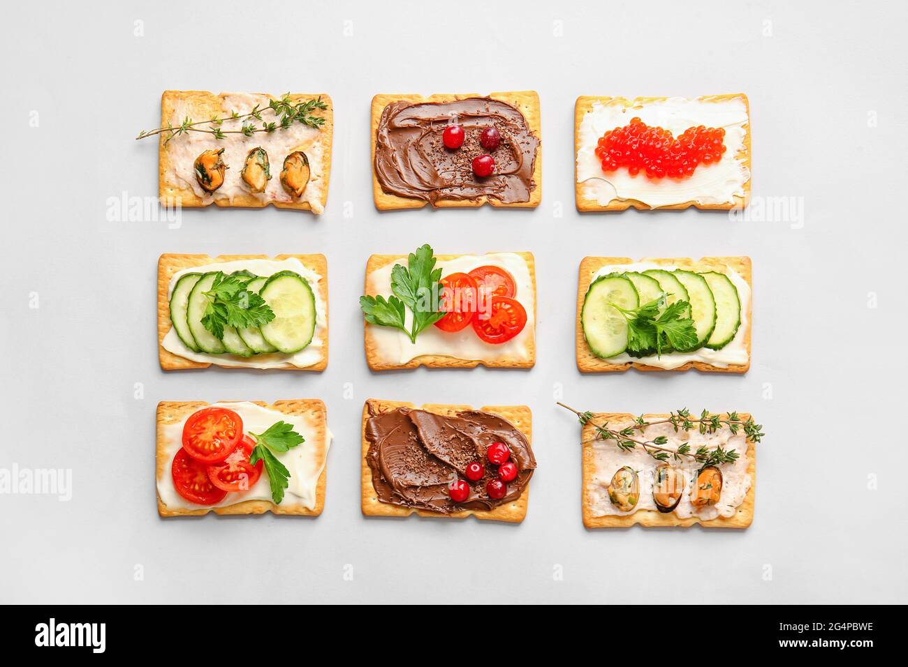 Different crackers on grey background Stock Photo - Alamy