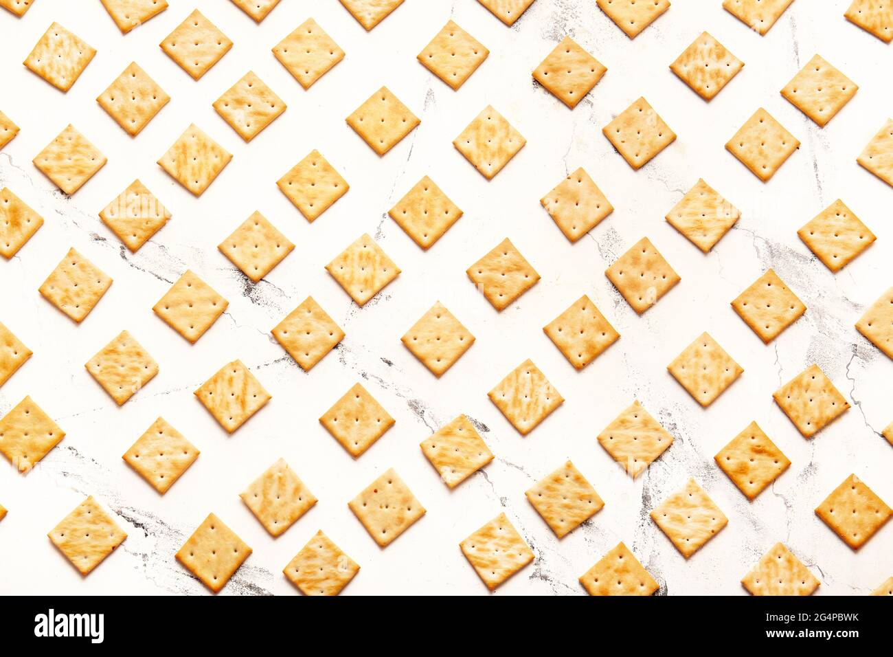 Tasty crackers on light background Stock Photo - Alamy