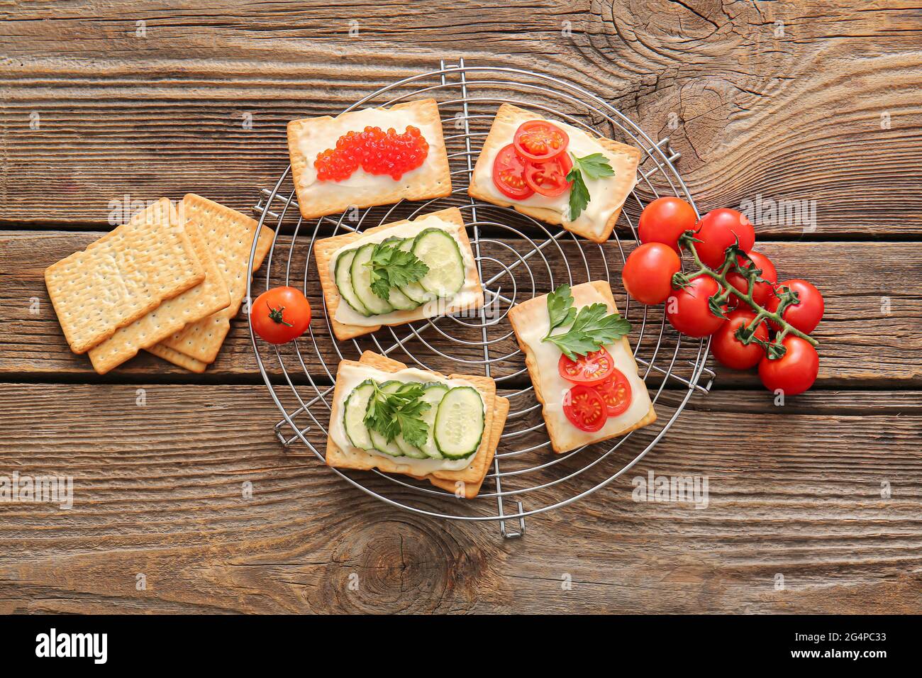 Different crackers on wooden background Stock Photo - Alamy