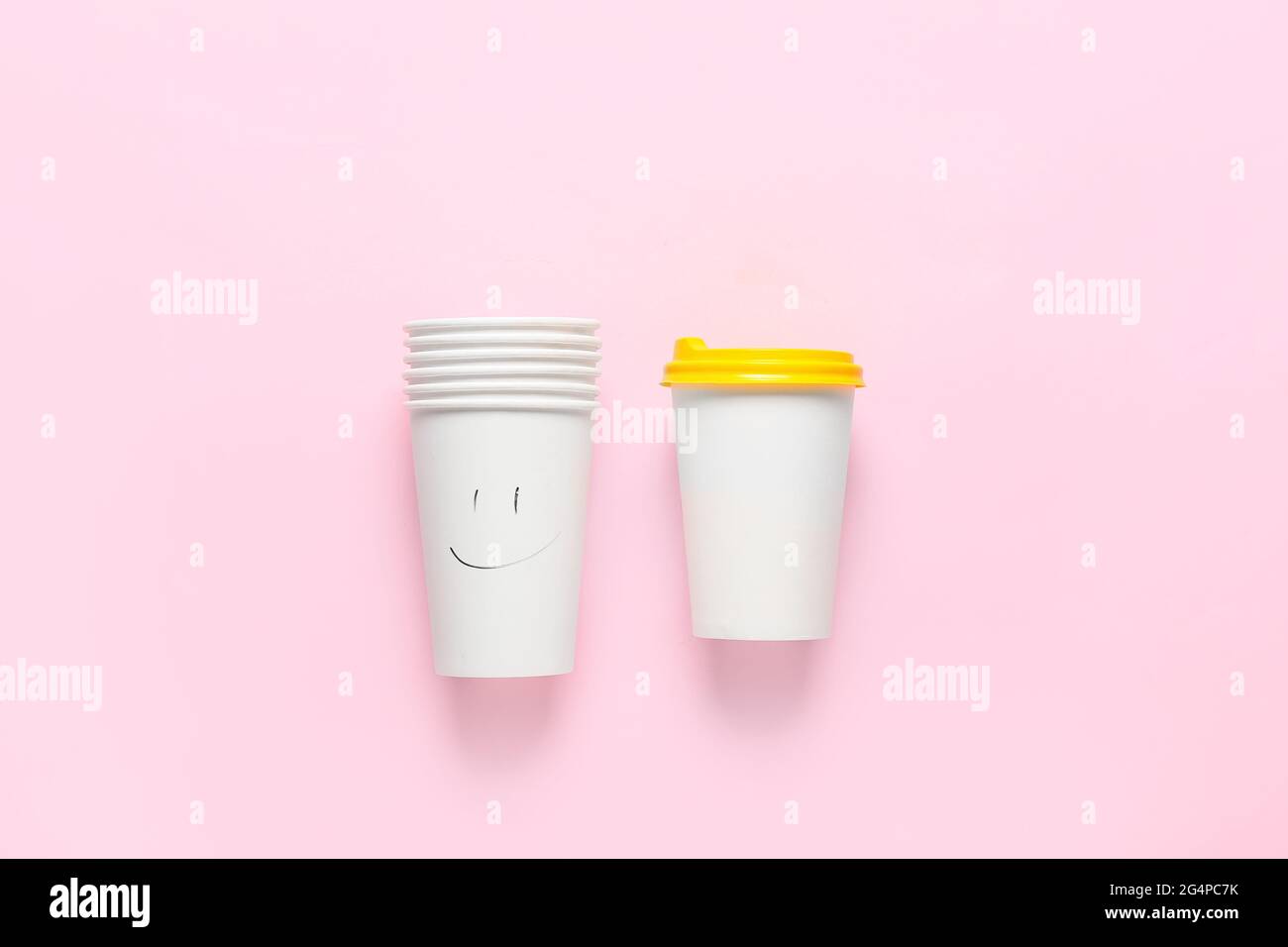 Takeaway cups for coffee with drawn smile on color background Stock ...