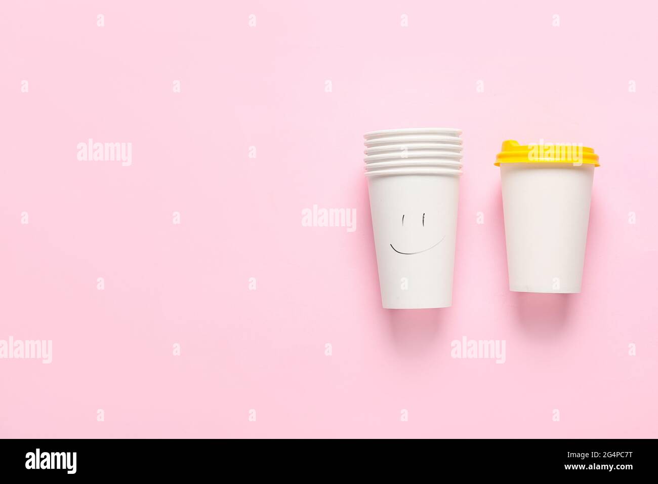 Takeaway cups for coffee with drawn smile on color background Stock ...