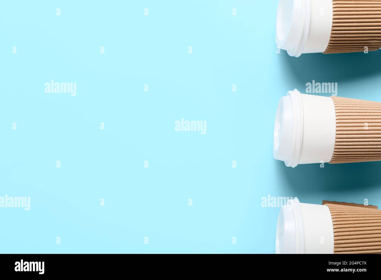 Takeaway cups for coffee on color background Stock Photo - Alamy