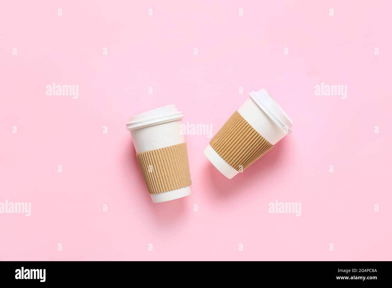 Takeaway cups for coffee on color background Stock Photo - Alamy