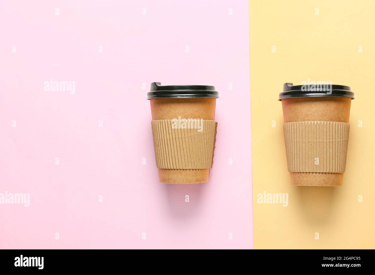 Takeaway cups for coffee on color background Stock Photo - Alamy
