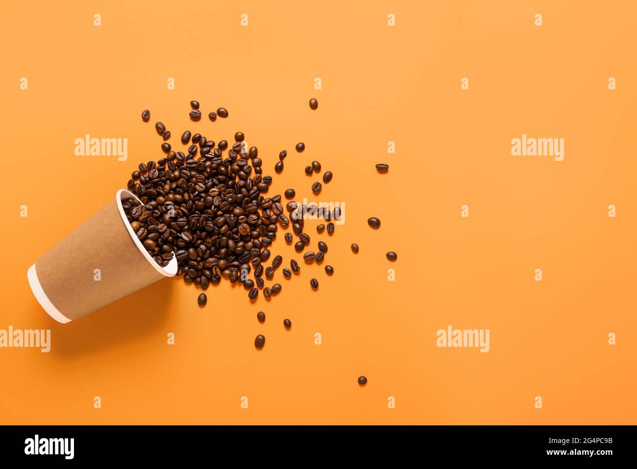 Takeaway cup for drink with coffee beans on color background Stock ...