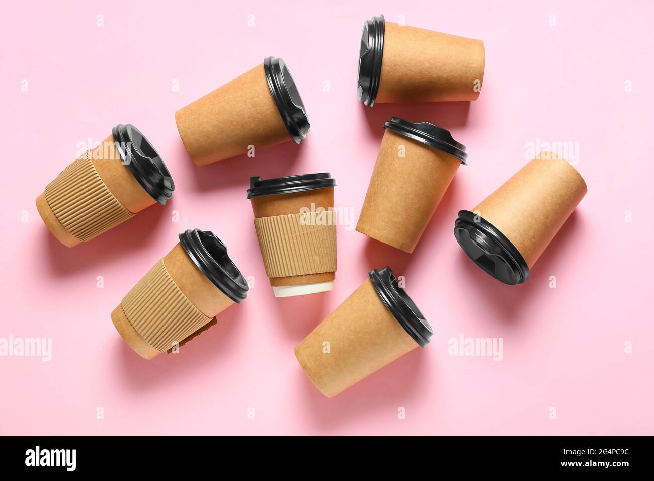 Takeaway cups for coffee on color background Stock Photo - Alamy