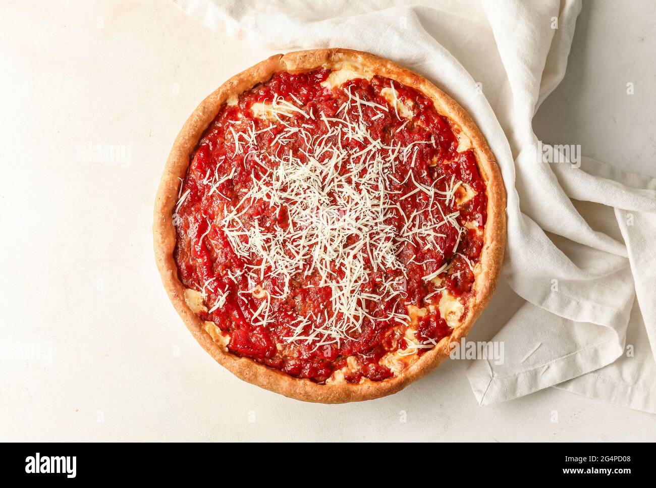 Tasty Chicago-style pizza on light background Stock Photo - Alamy