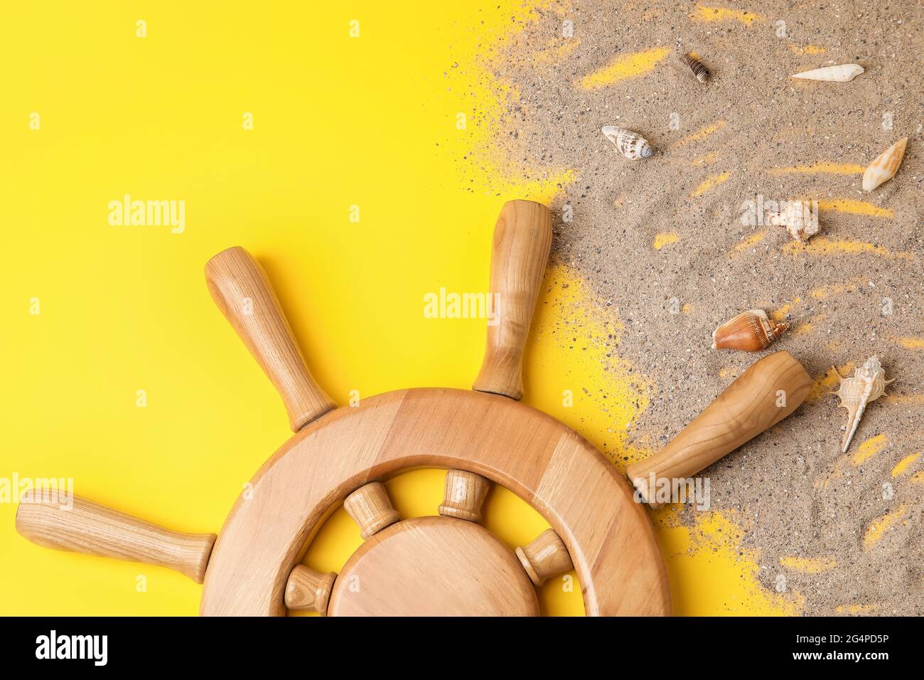 Helm, sand and sea shells on color background Stock Photo - Alamy